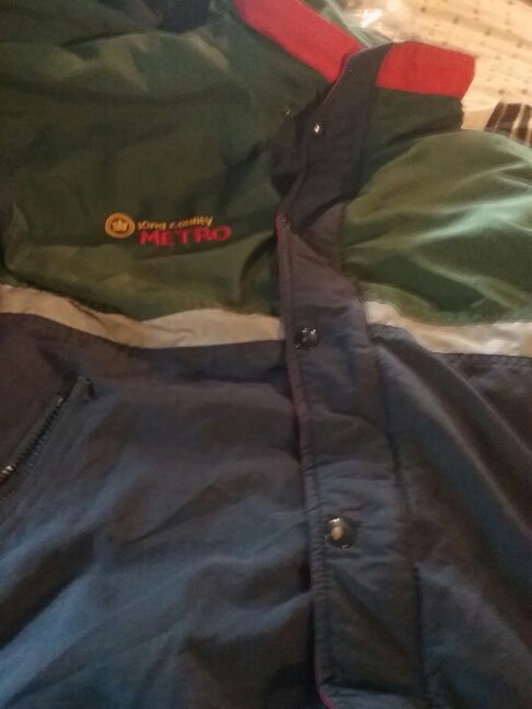 Seattle Metro bus jackets -- first green, Navy blue, silver, and red ...